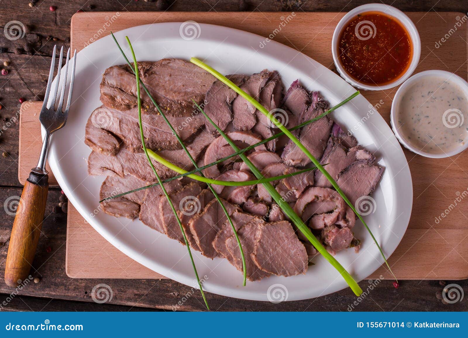 Different Types of Cooked Meat with Hot Sauces on Wooden Table Stock ...