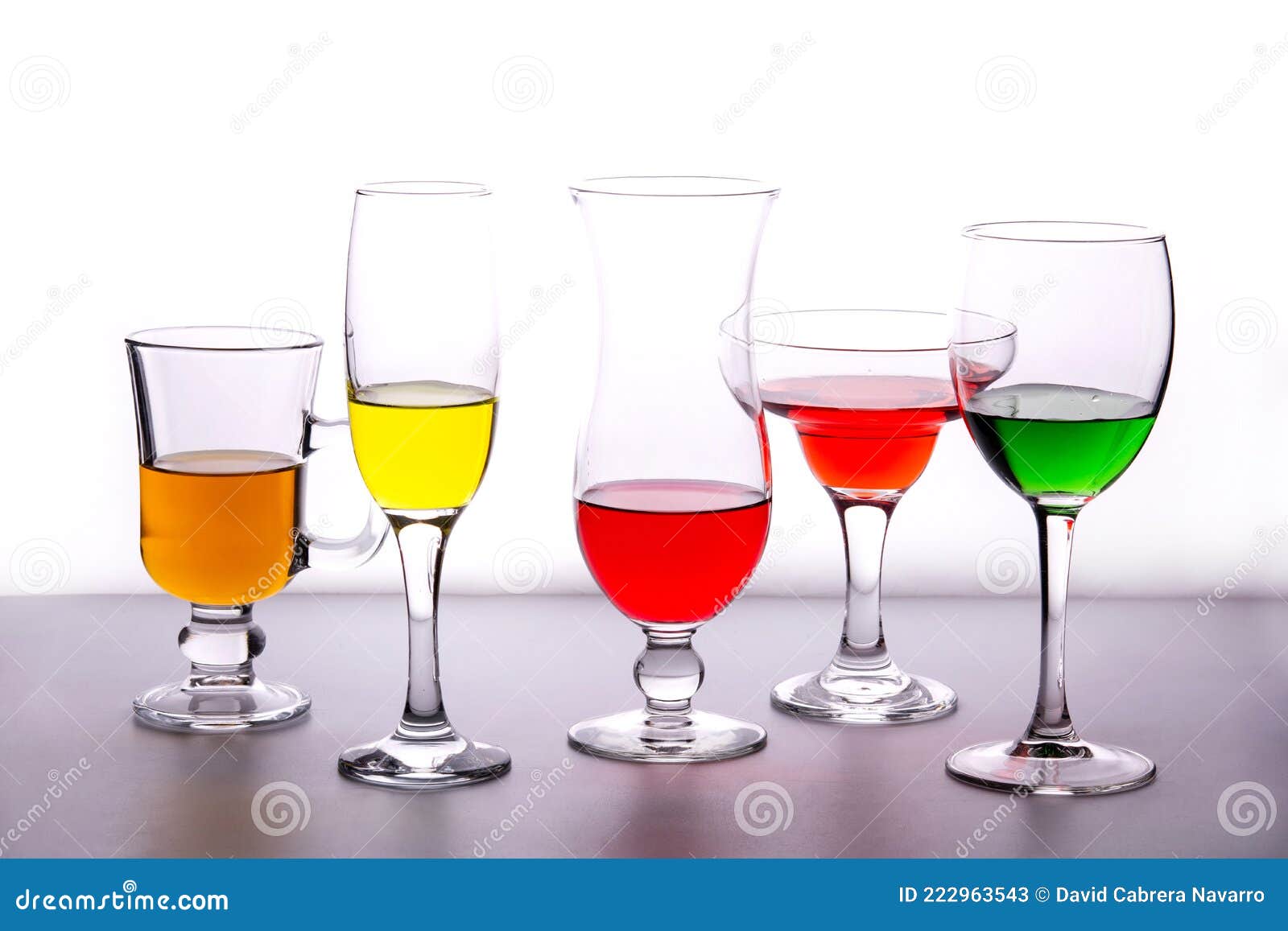 Different Types of Crystal Glasses with Colorful Liquid Inside Stock ...