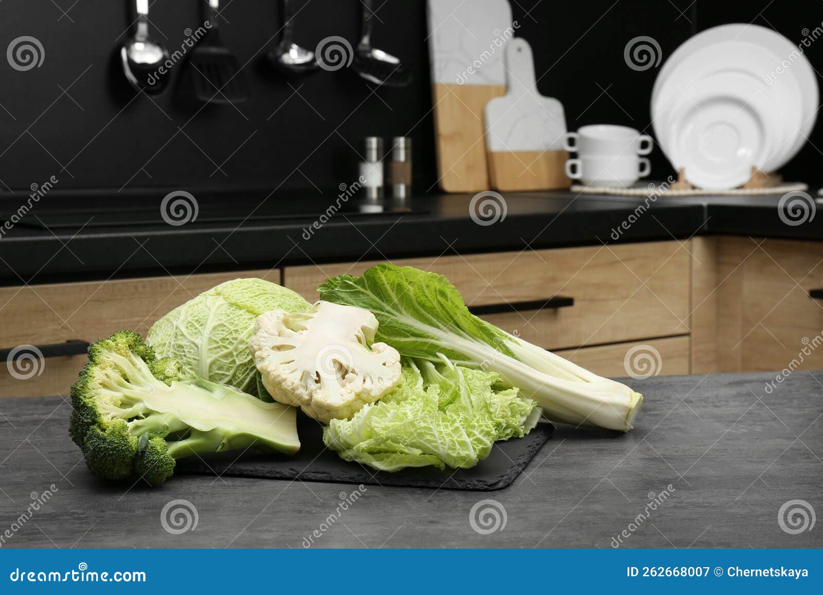 Different Types of Cut Cabbage on Grey Table in Kitchen Stock Image ...