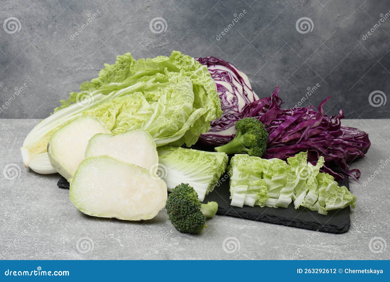 Different Types of Cut Cabbage on Light Grey Table Stock Photo - Image ...