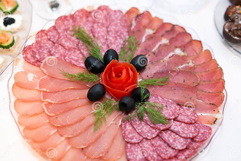 Different Types Delicacies of Meat and Cheese Arranged in a Plate Over ...