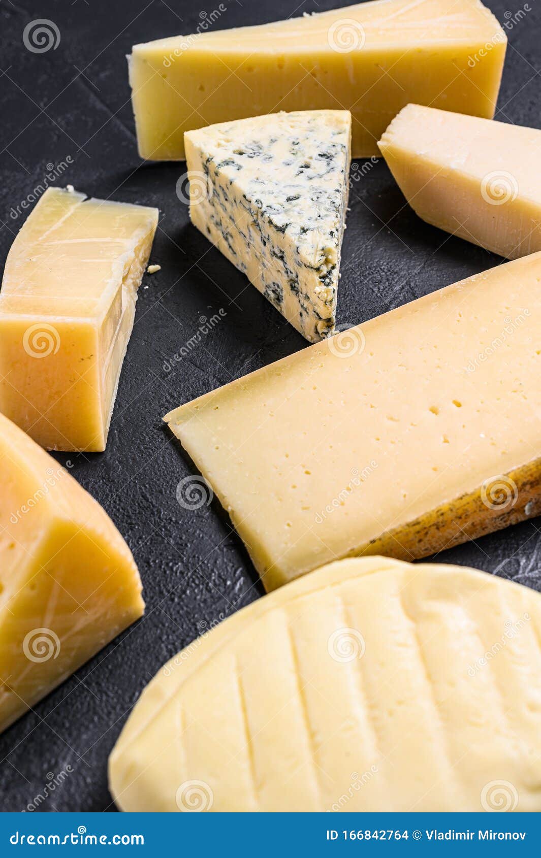 Different Types of Delicious Cheese. Black Background Stock Photo ...