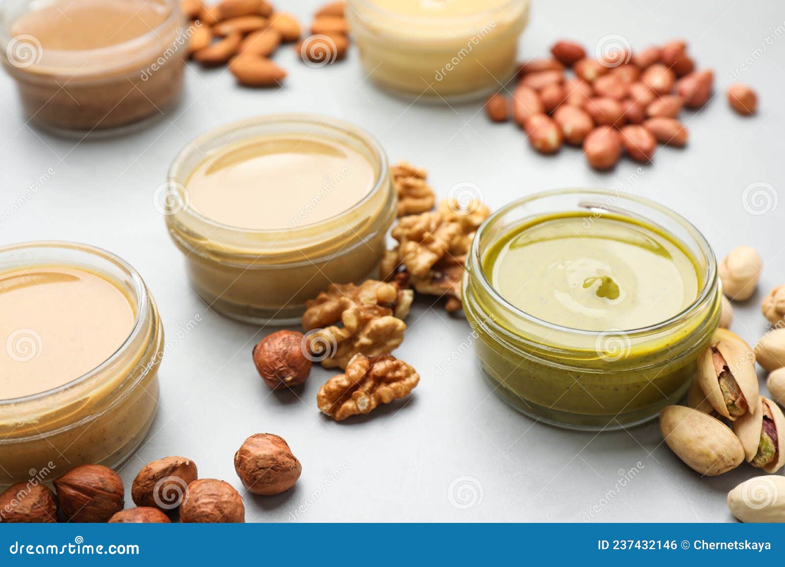 Different Types of Delicious Nut Butters and Ingredients on Light Table ...