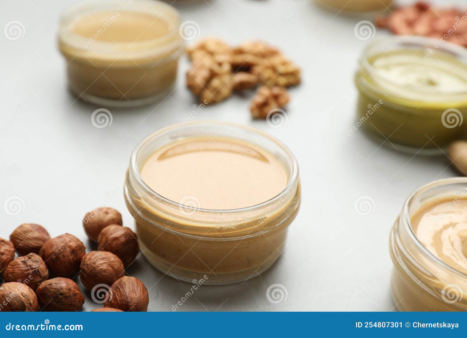 Different Types of Delicious Nut Butters and Ingredients on Light Table ...