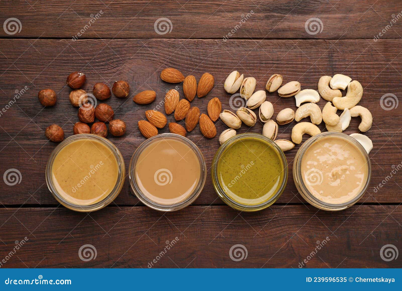 Different Types of Delicious Nut Butters and Ingredients on Wooden ...
