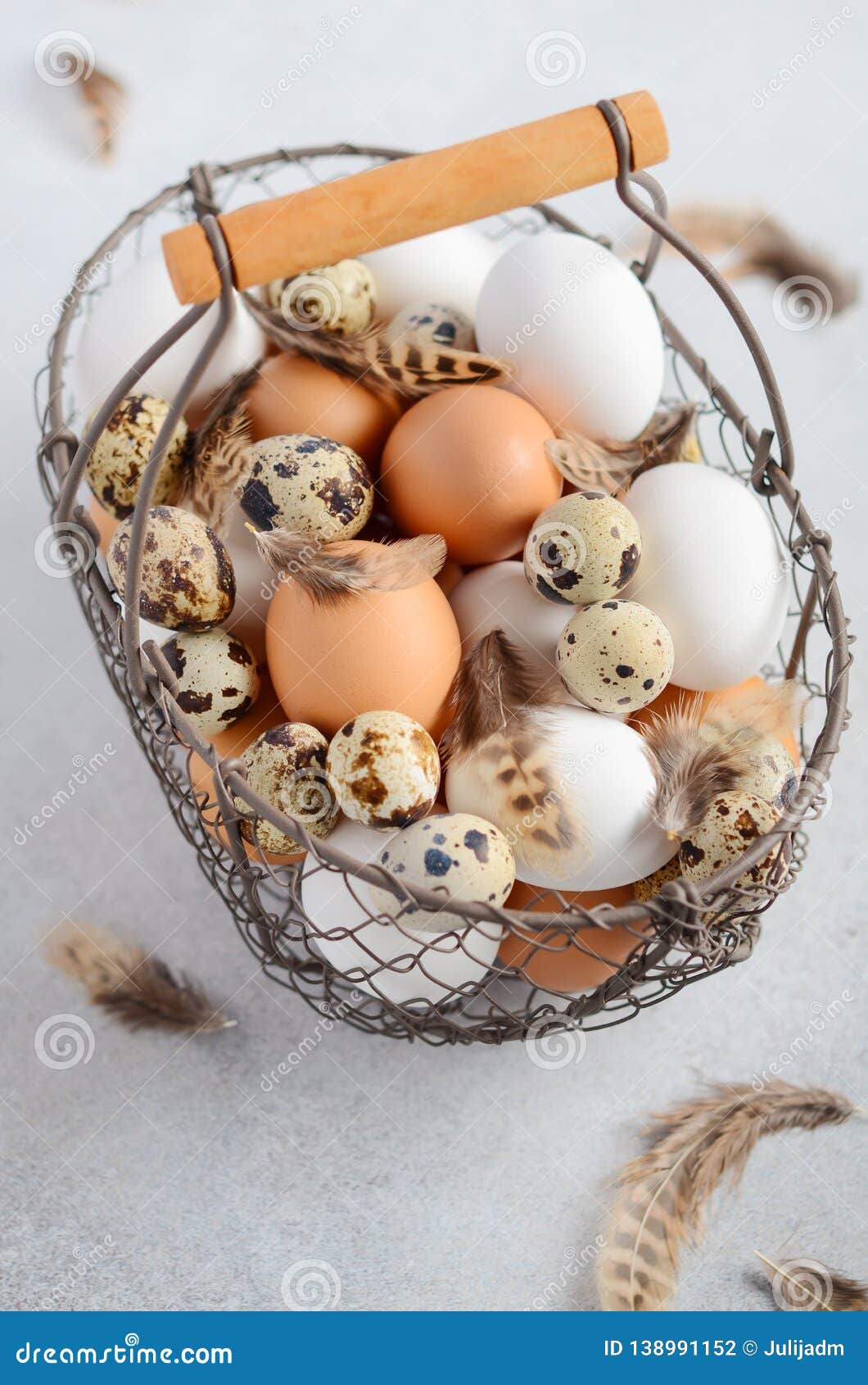 Different Types of Eggs in a Basket on a Gray Concrete Background ...