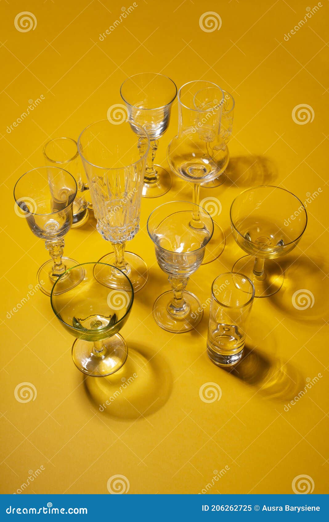 Different Types of Empty Glasses on Yellow Background Stock Image ...