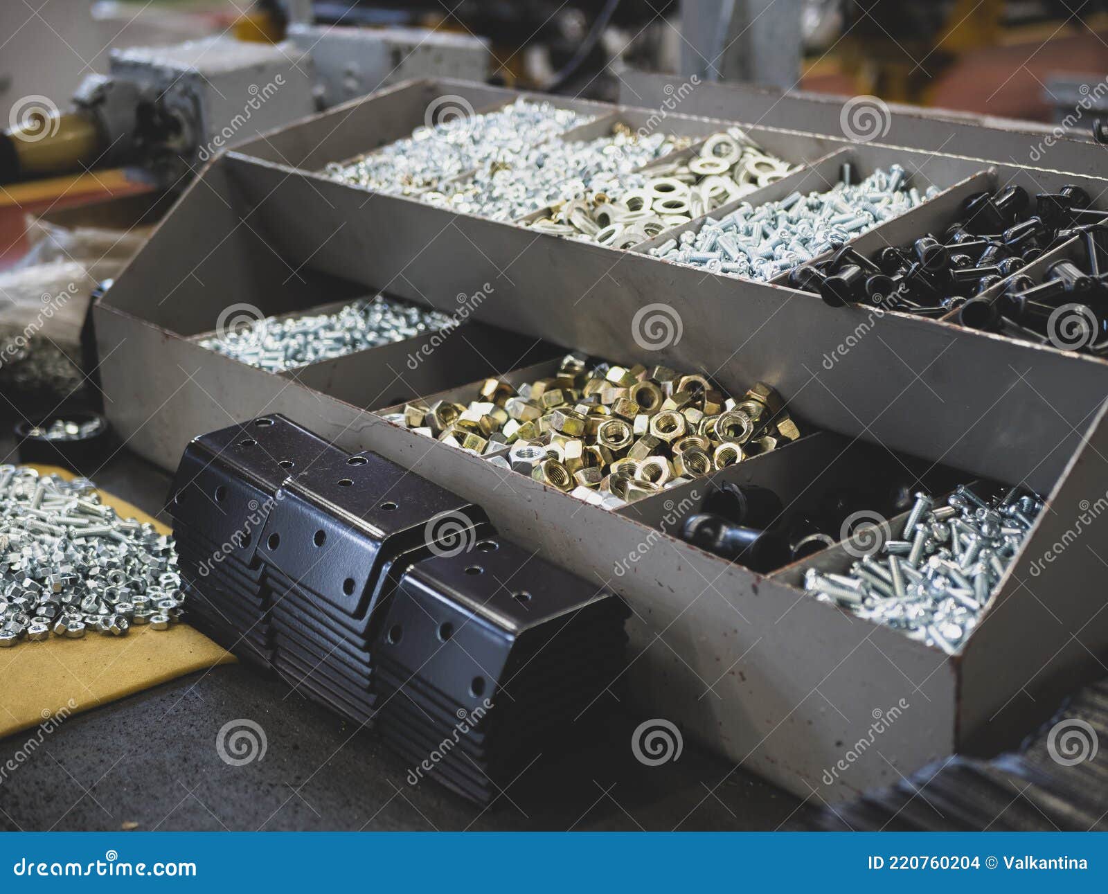 Different Types of Fasteners on the Worker`s Table. Work Place at the ...