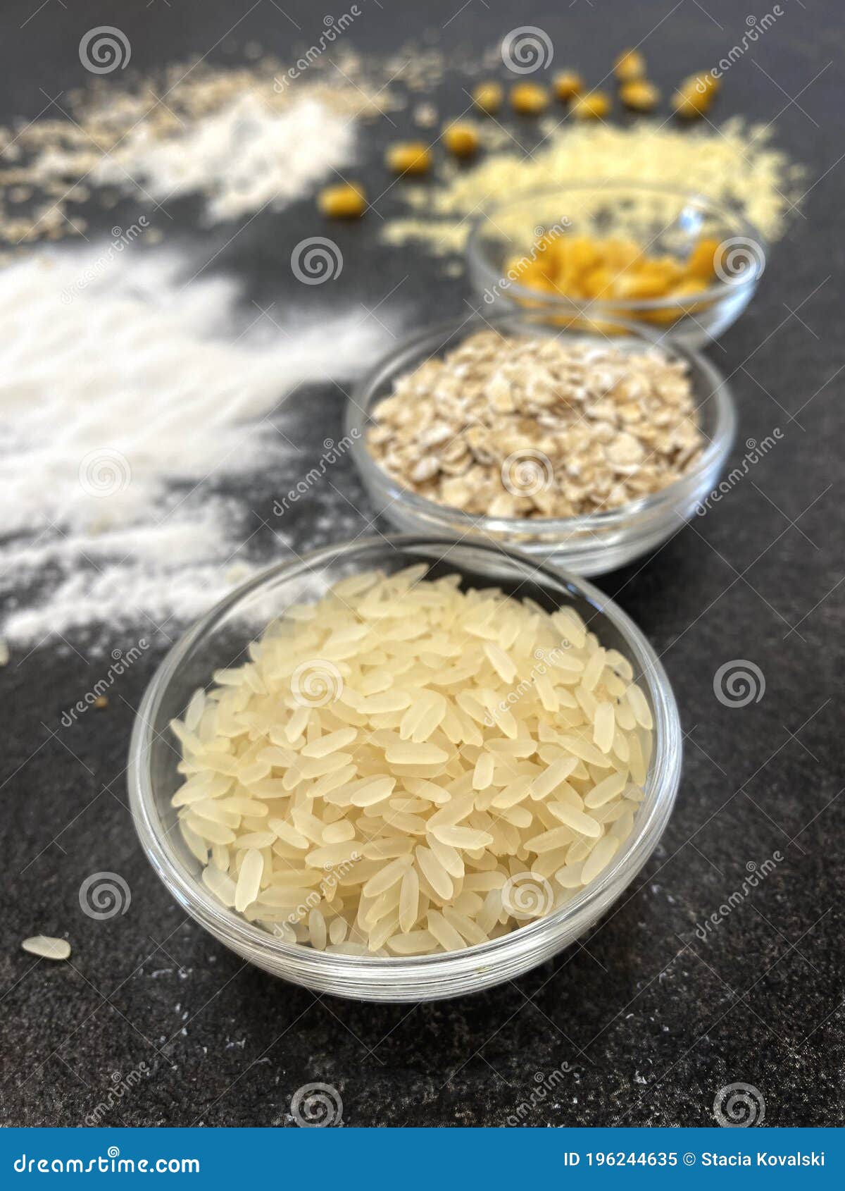 Different Types of Flour and Grains on a Dark Textured Background Stock ...