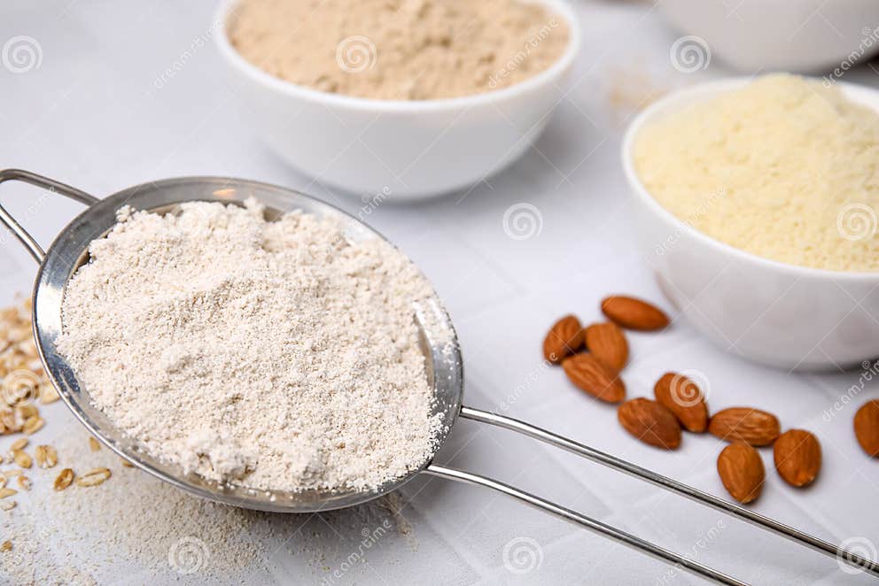 Different Types of Flour on Tiled Table, Closeup Stock Photo - Image of ...