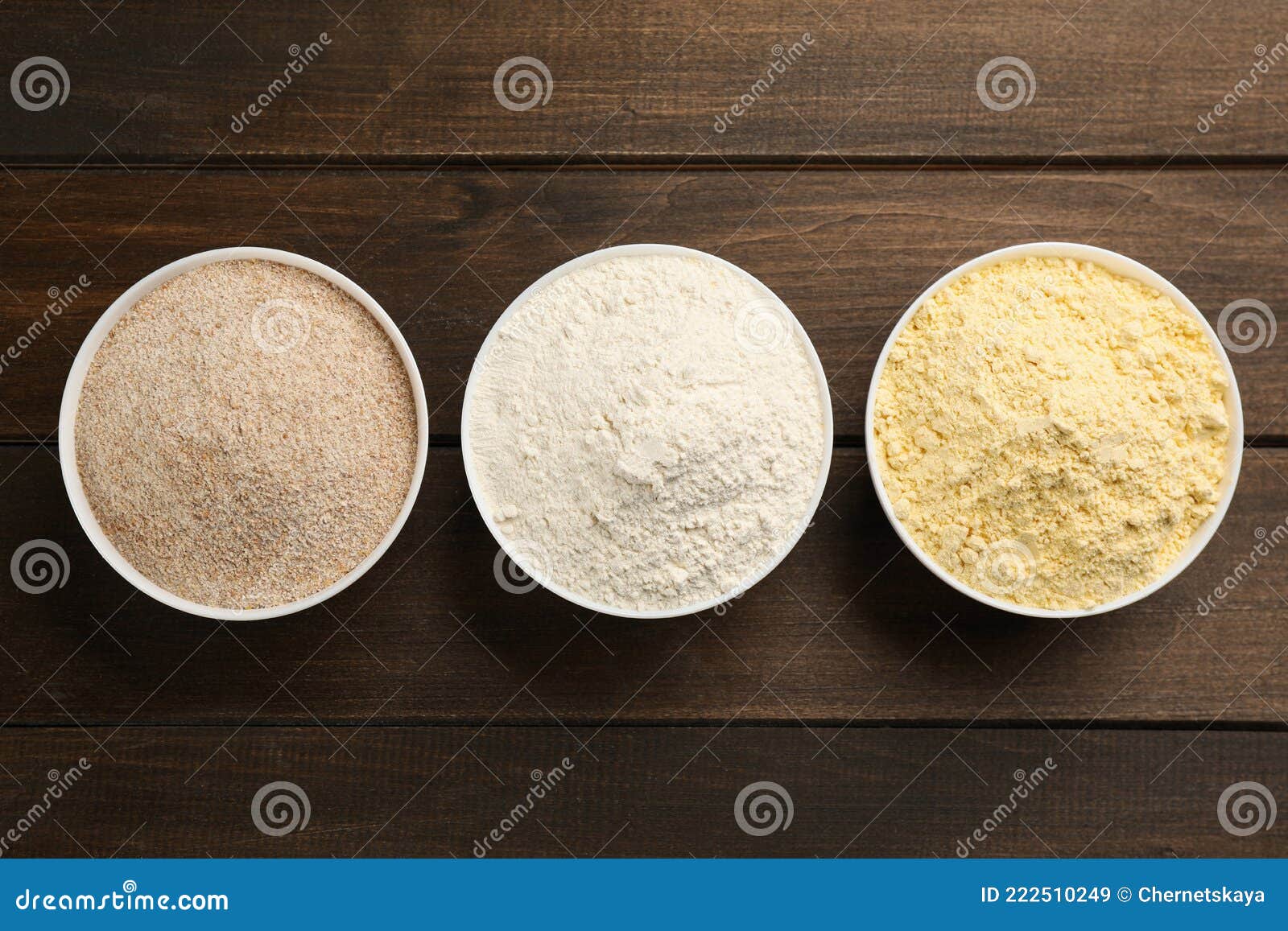 Different Types of Flours on Bowls on Wooden Table, Flat Lay Stock ...