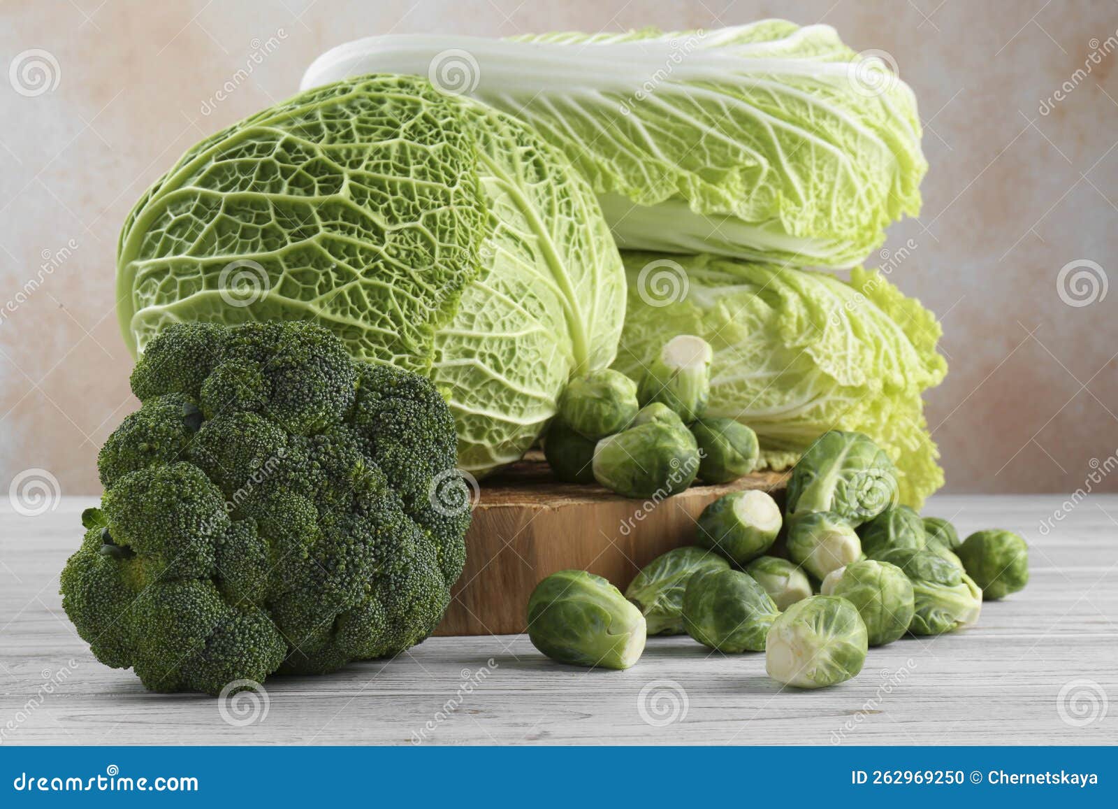 Different Types of Fresh Cabbage on White Wooden Table Stock Photo ...