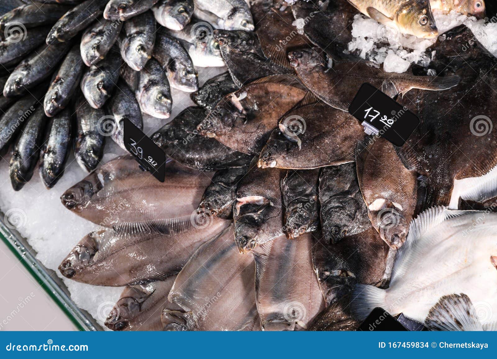 Different Types of Fresh Fish on Ice in Supermarket Stock Photo - Image ...