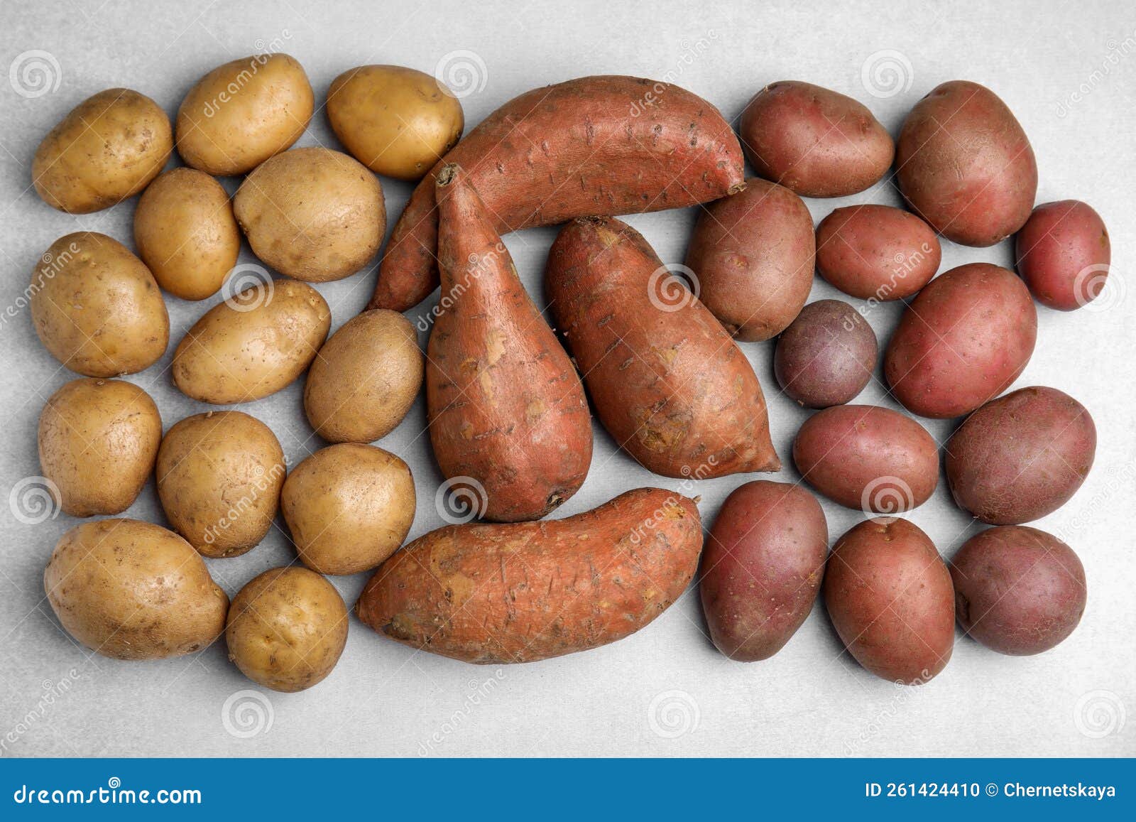 Different Types of Fresh Potatoes on Light Gray Table, Flat Lay Stock ...