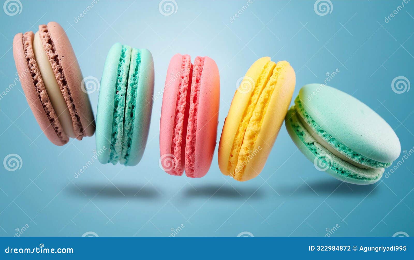 Different Types of Macaroons in Motion Falling on Light Blue Background ...