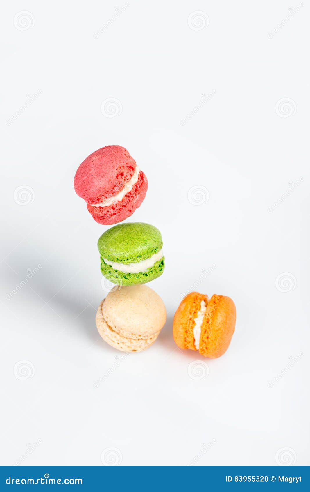 Different Types of Macaroons in Motion Falling on White Background ...