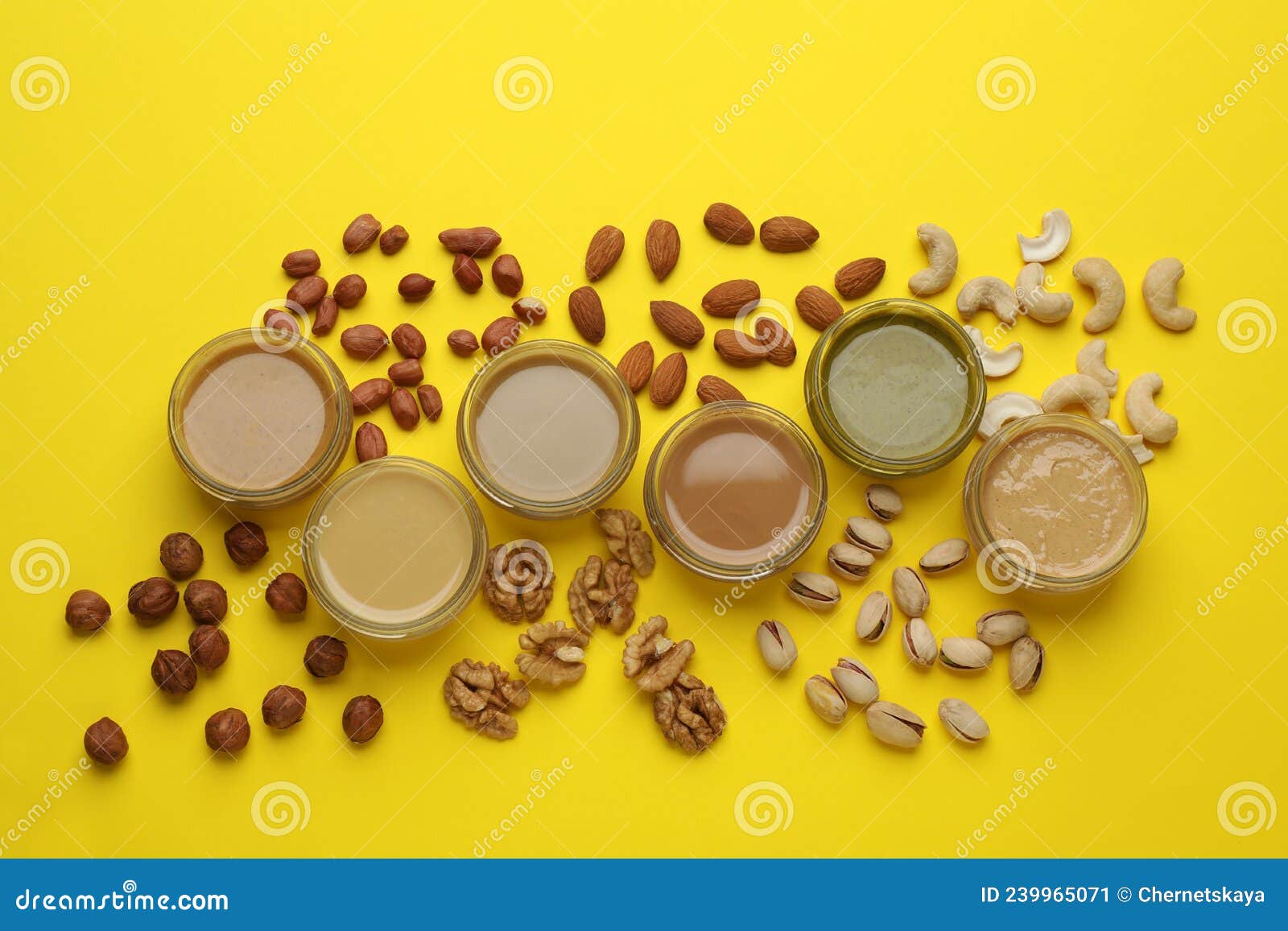 Different Types of Nut Butter and Ingredients on Yellow Background ...