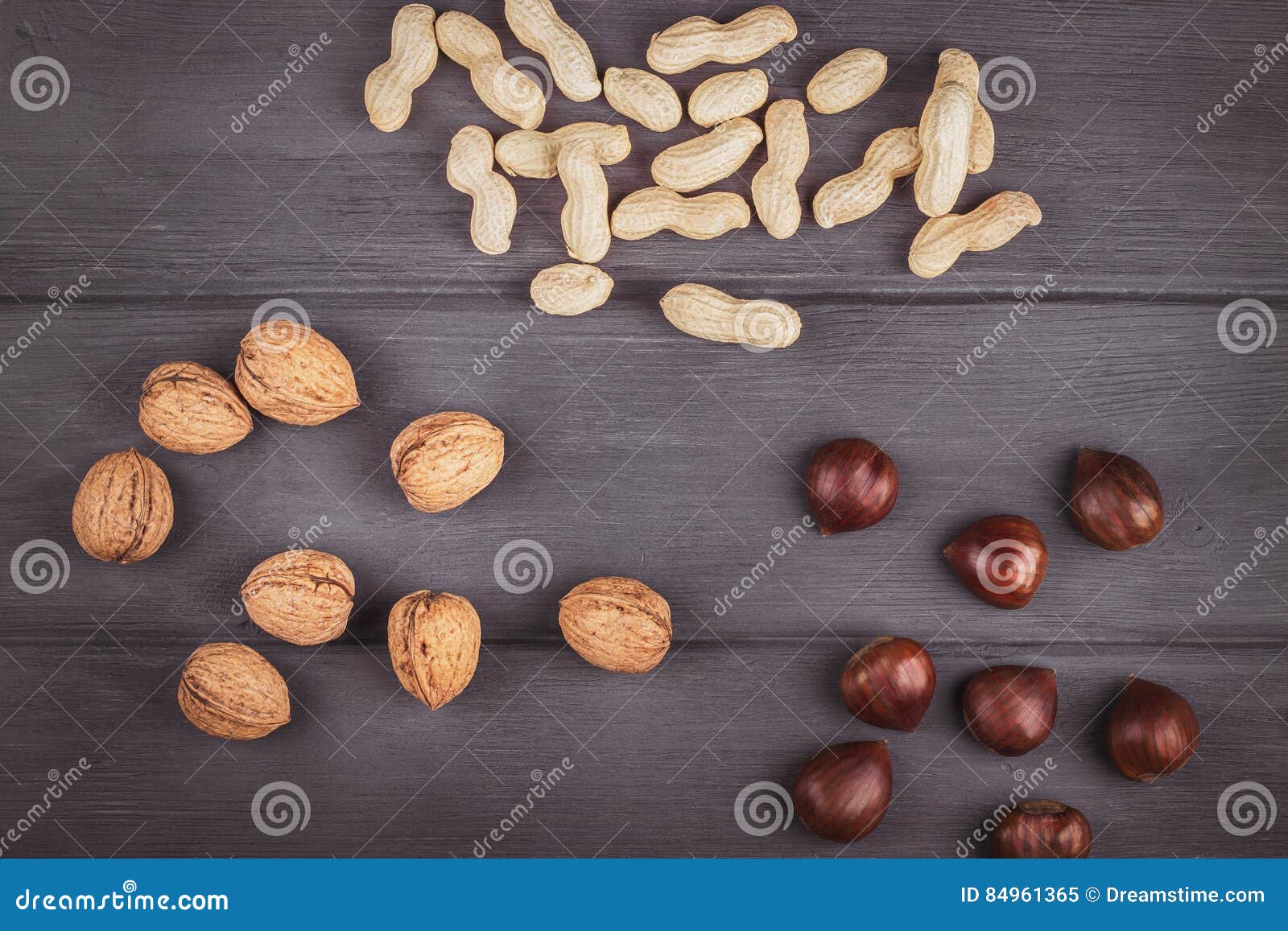 Different Types of Nuts: Walnut, Peanut, Chestnut on Wooden Stock Image ...