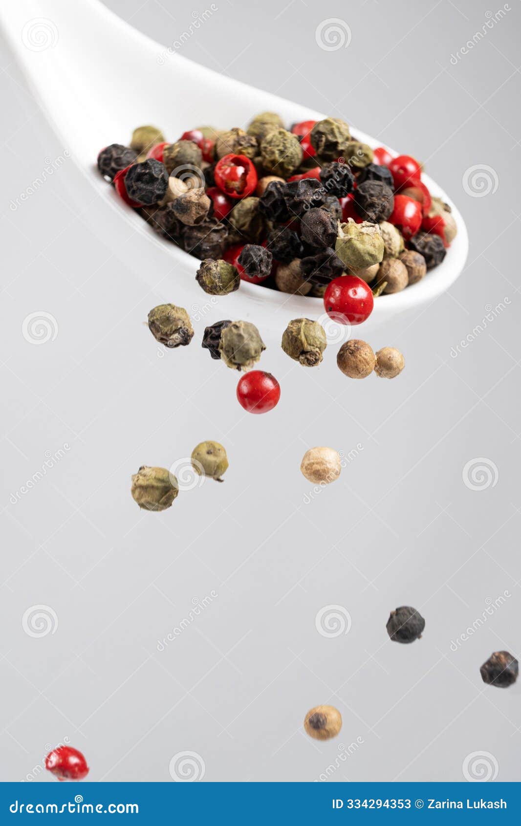 Different Types of Peppercorns Pouring. Red, Green, White and Black ...