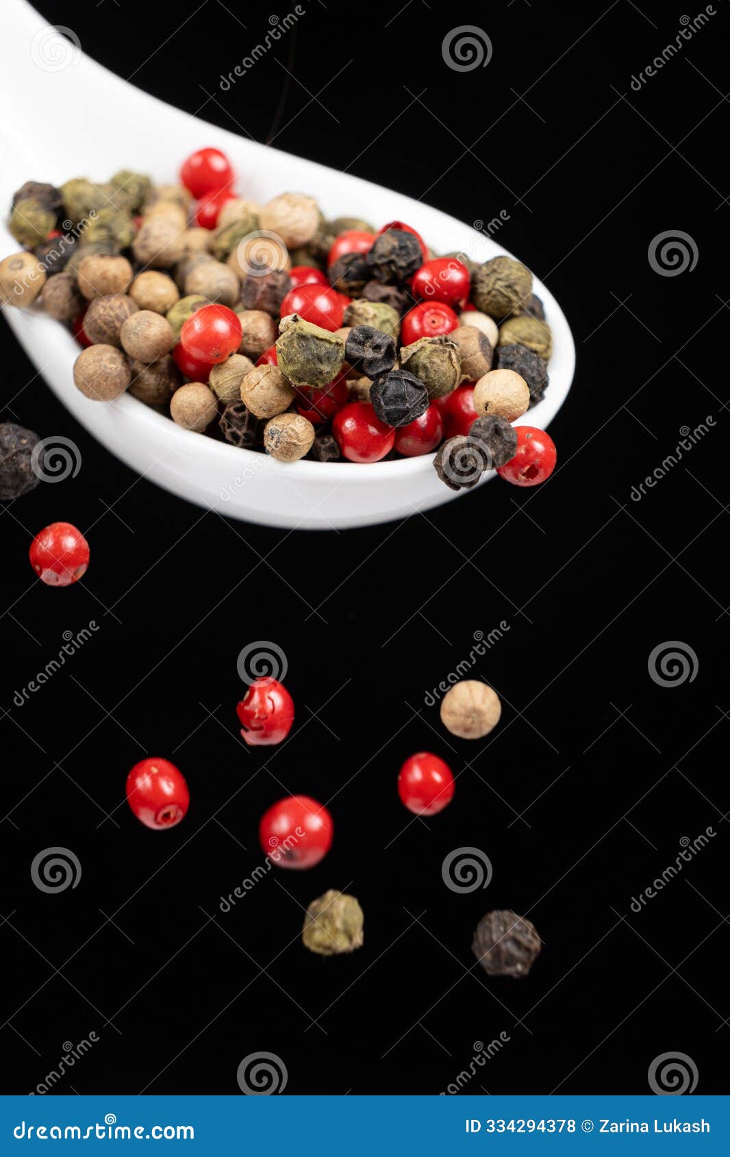 Different Types of Peppercorns Pouring. Red, Green, White and Black ...