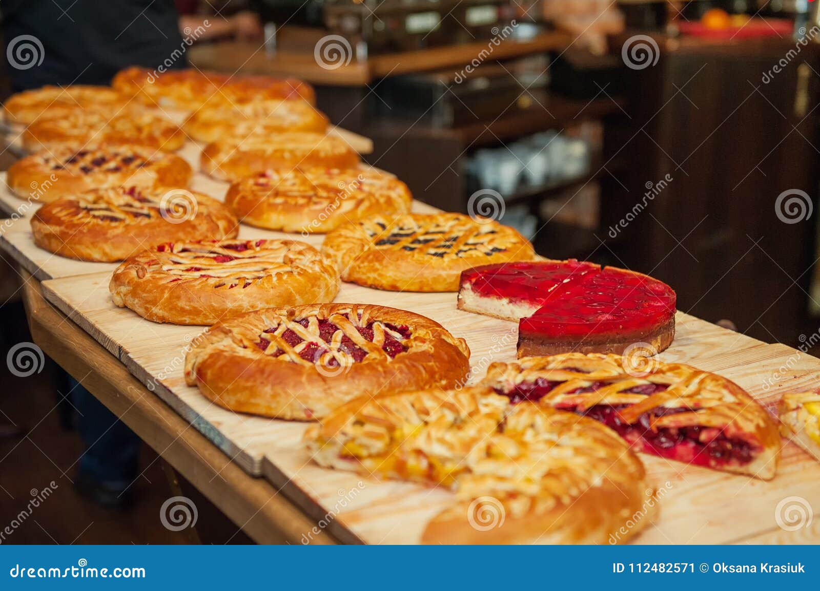 Different Types of Pies in Pastry Shop on the Wooden Display. Selective ...