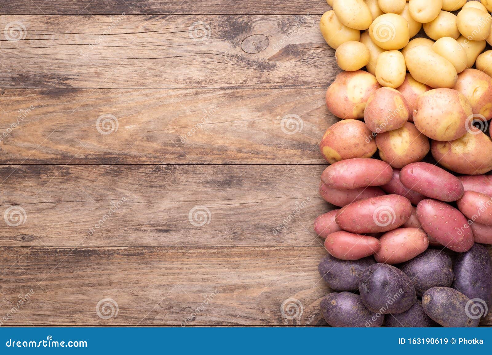 Different Types of Potatoes on Wooden Rustic Table Stock Image - Image ...