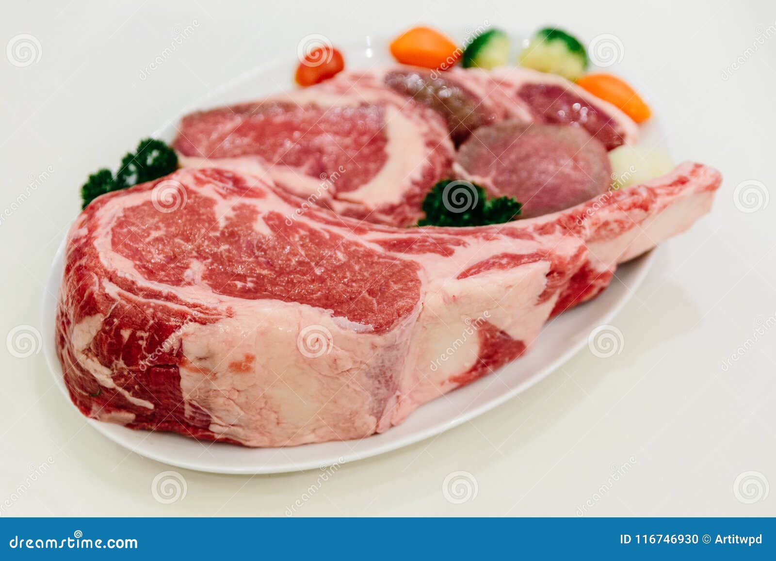 Different Types of Raw Beef with Fresh Herbs and Vegetables on the ...