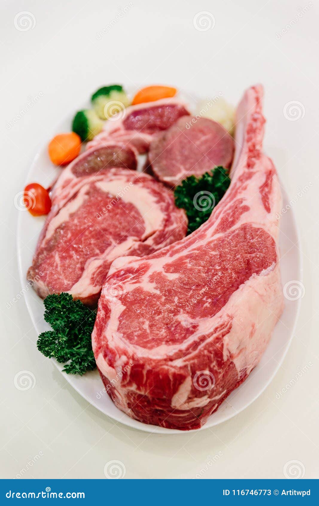 Different Types of Raw Beef with Fresh Herbs and Vegetables on the ...