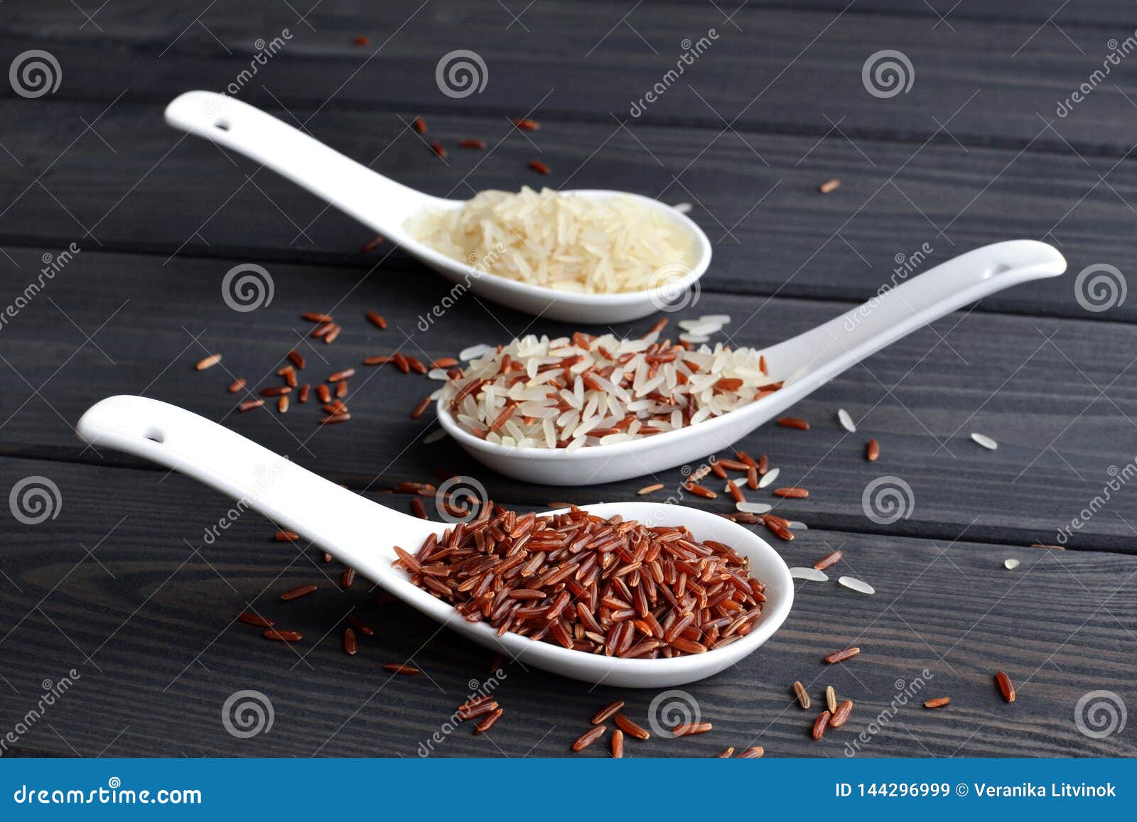 Different Types of Rice in Spoons on Wooden Table Background Stock ...