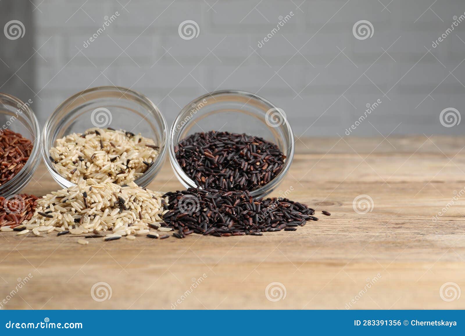 Different Types of Rice on Wooden Table, Closeup. Space for Text Stock ...