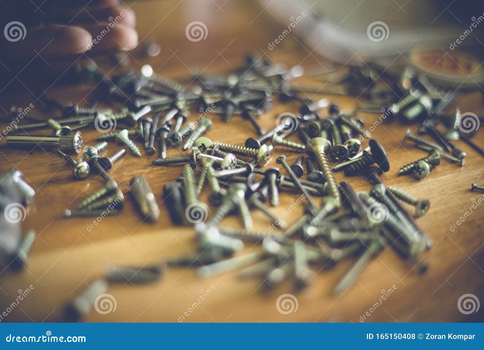 Different Types and Sizes of Nails and Screws on a Wooden Table Stock ...