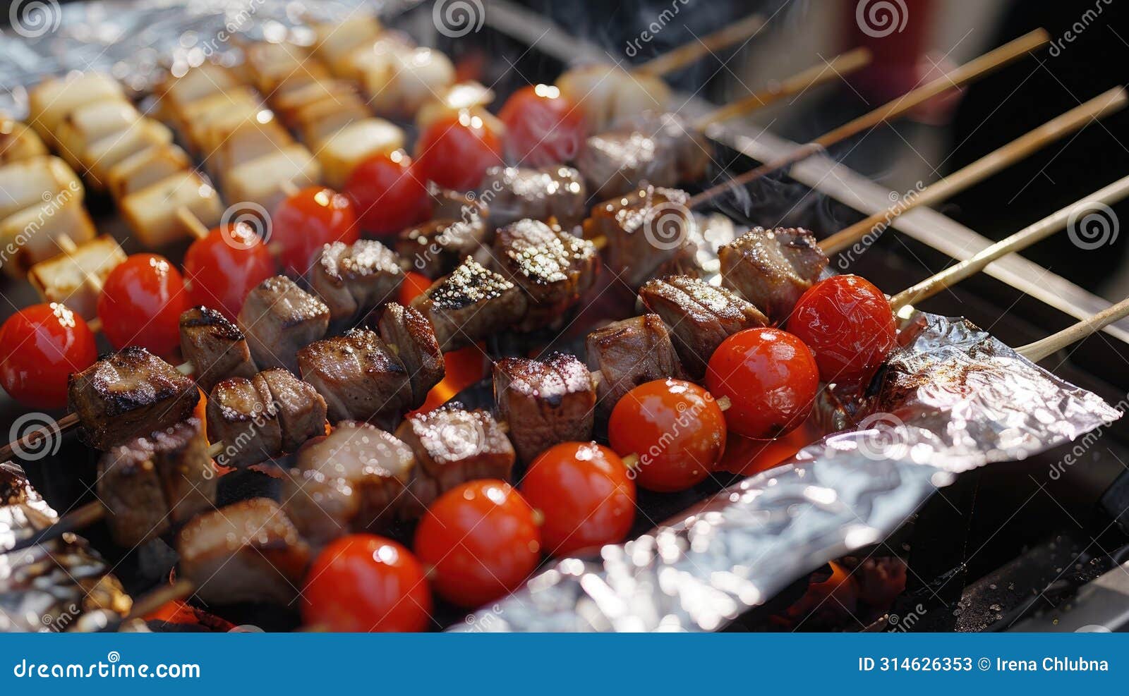 Different Types of Small Skewers with Meat and Cherry Tomatoes Being ...