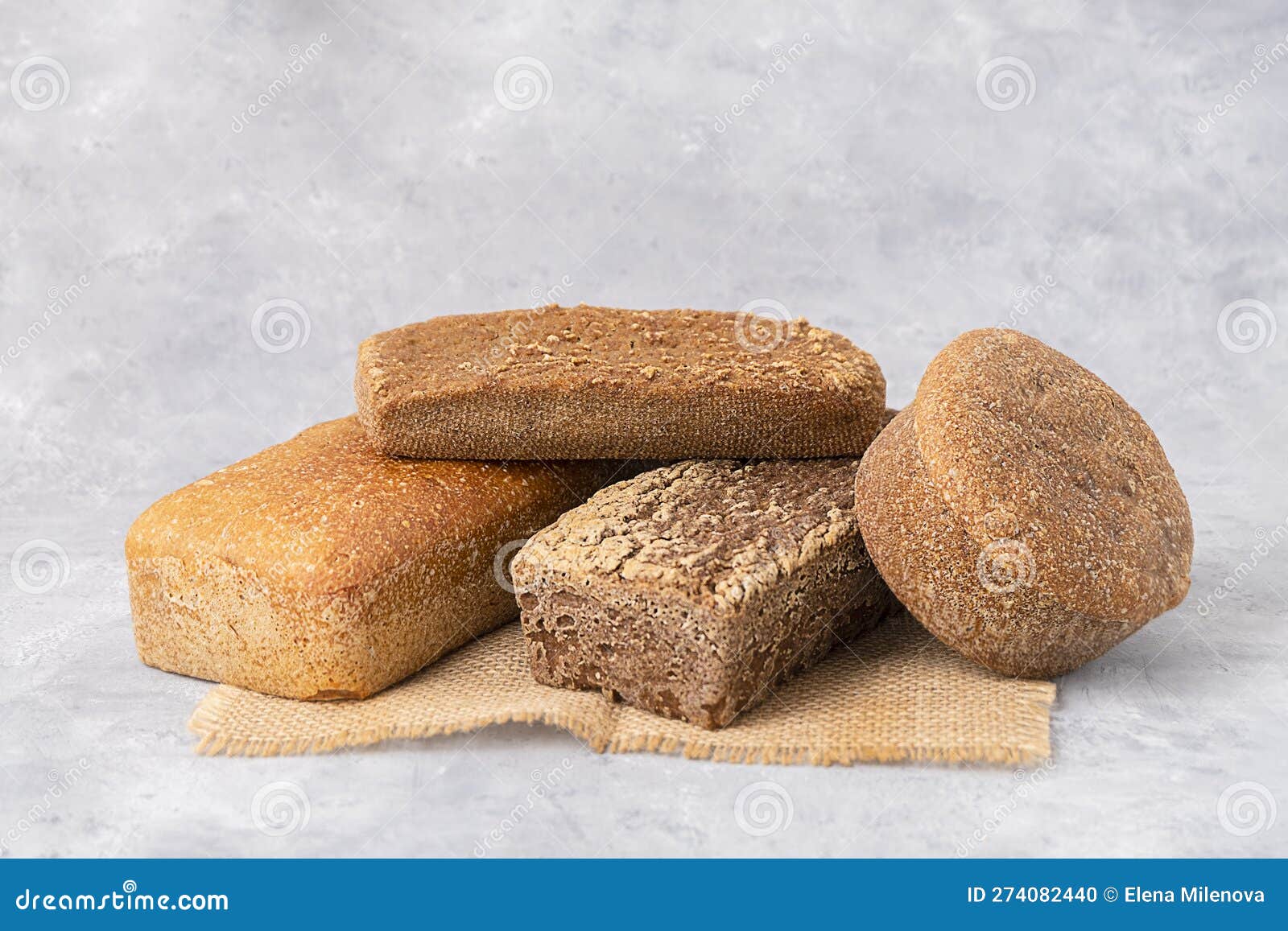 Different Types of Sourdough Bread on Light Grey Background Stock Photo ...