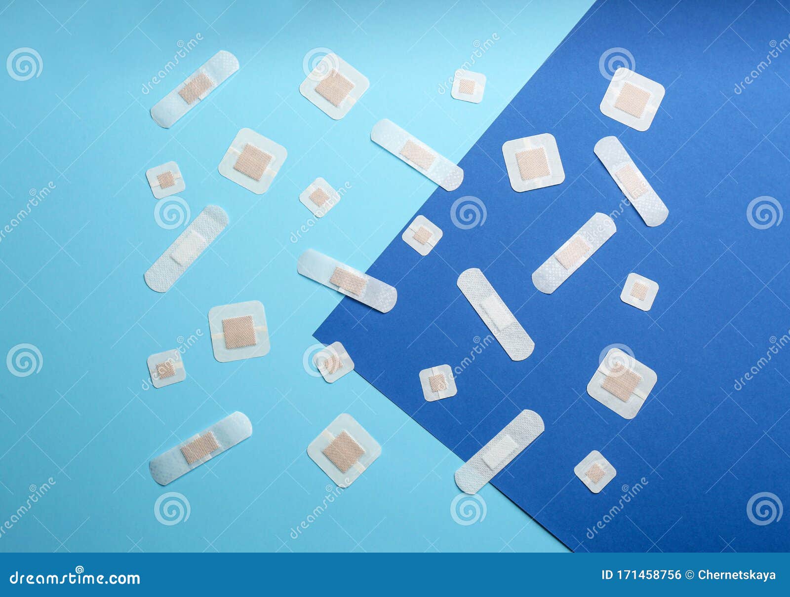 Different Types of Sticking Plasters on Blue Background Stock Photo ...