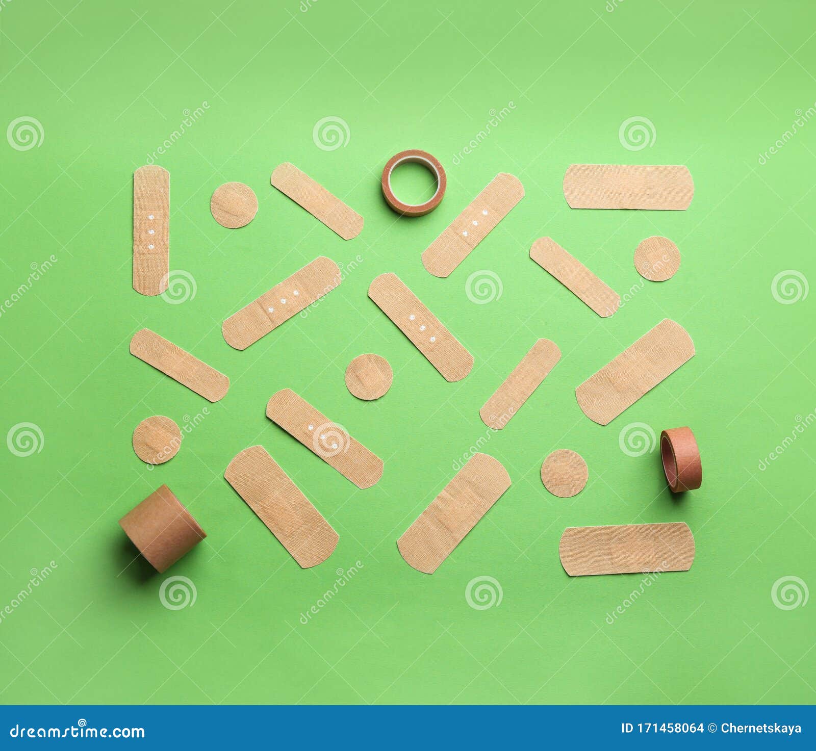 Different Types of Sticking Plasters on Green Background, Flat Lay ...