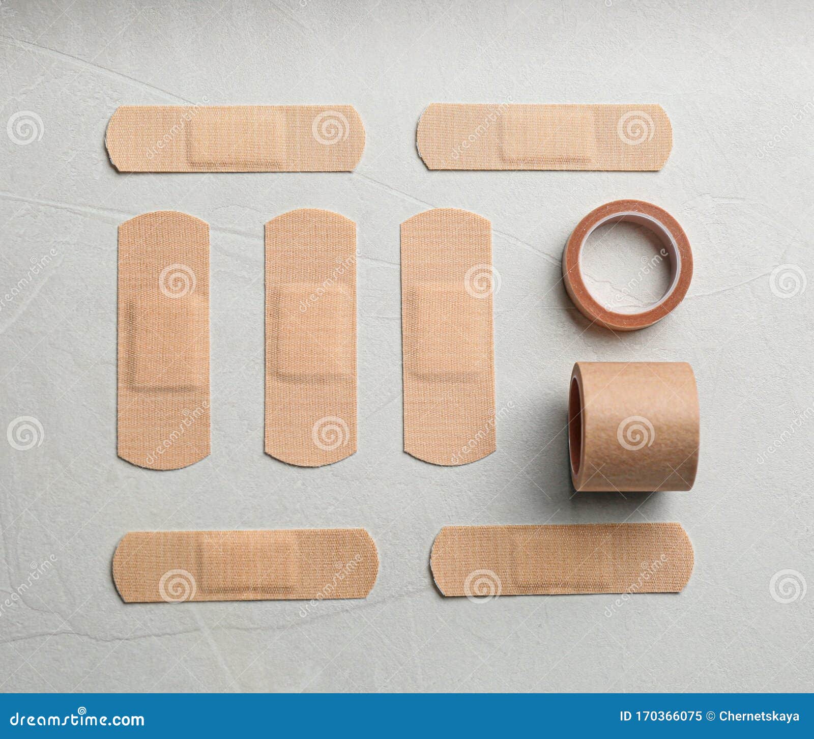 Different Types of Sticking Plasters on Light Stone Background, Flat ...