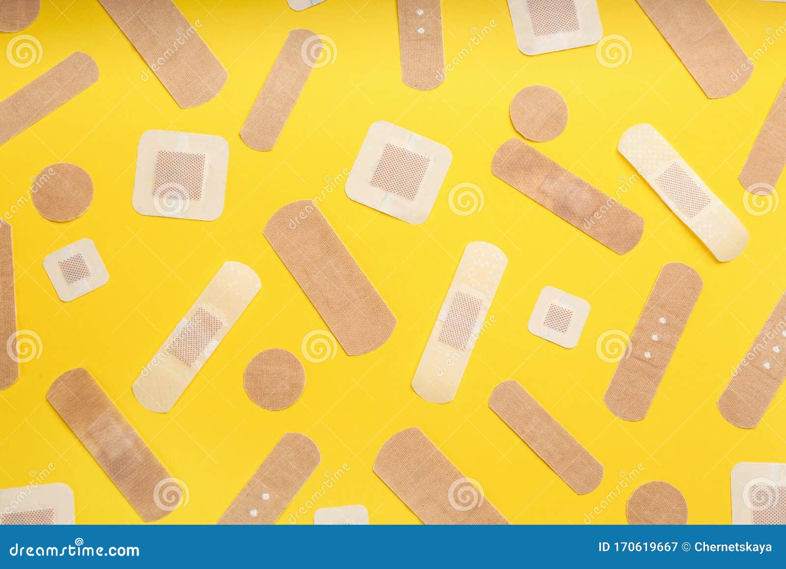 Different Types of Sticking Plasters on Yellow Background, Flat Lay ...