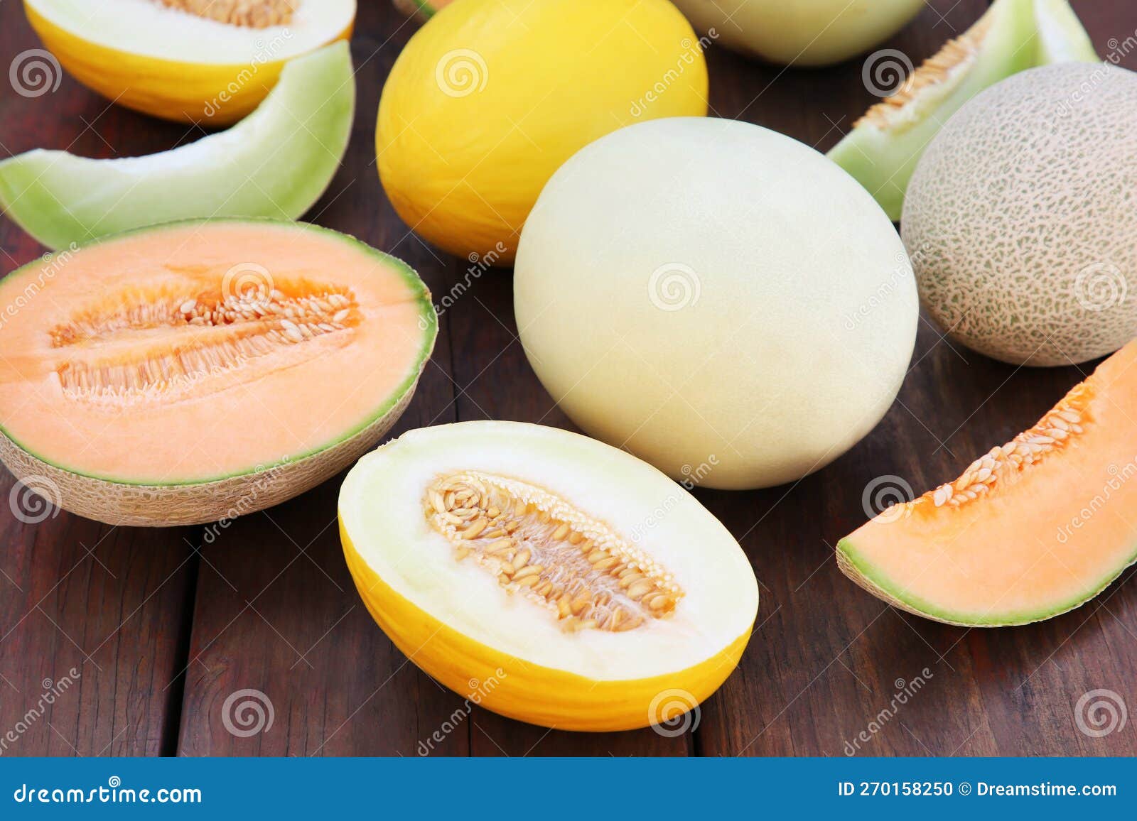 Different Types of Tasty Ripe Melons on Wooden Table Stock Photo ...