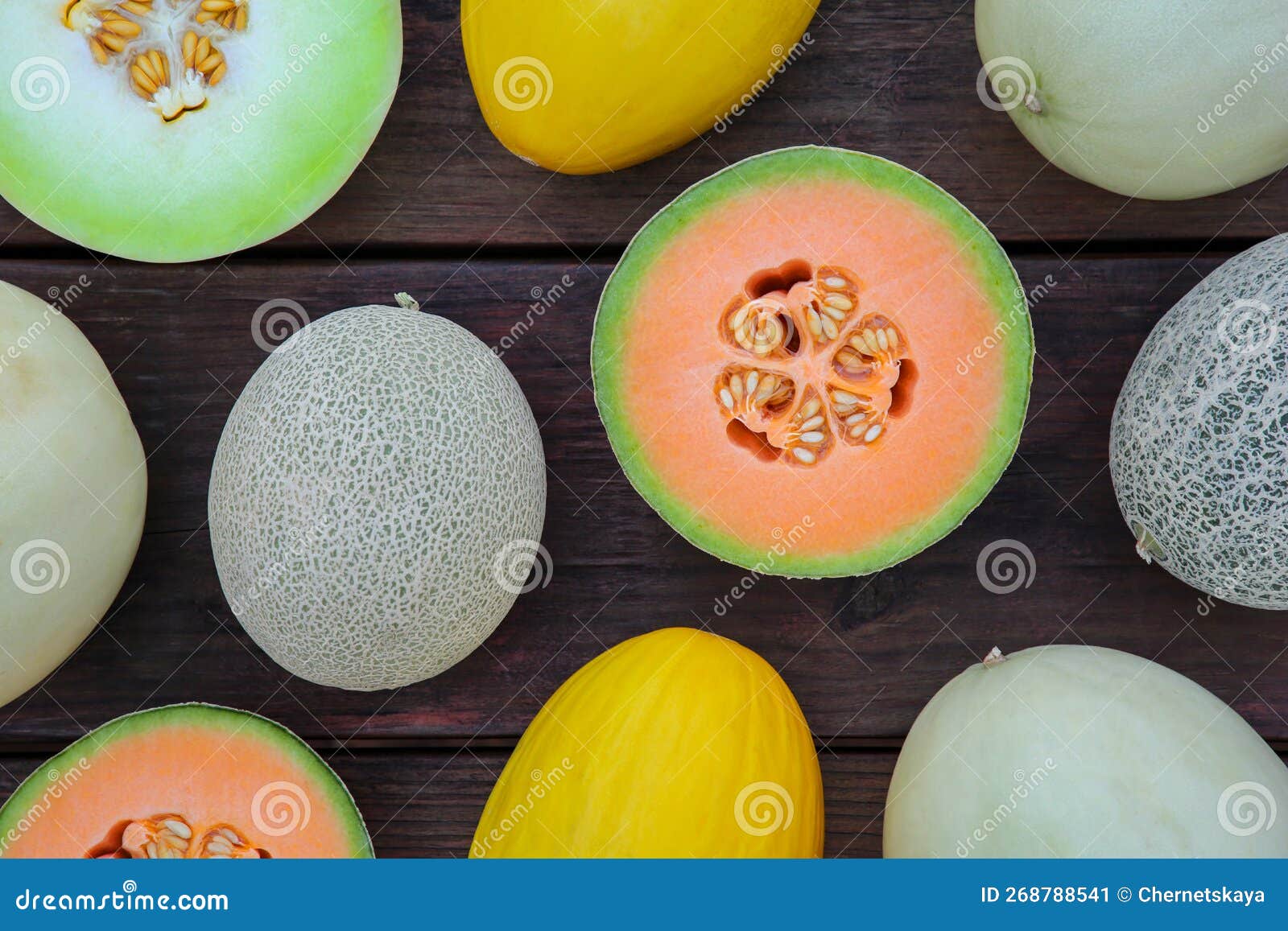 Different Types of Tasty Ripe Melons on Wooden Table, Flat Lay Stock ...