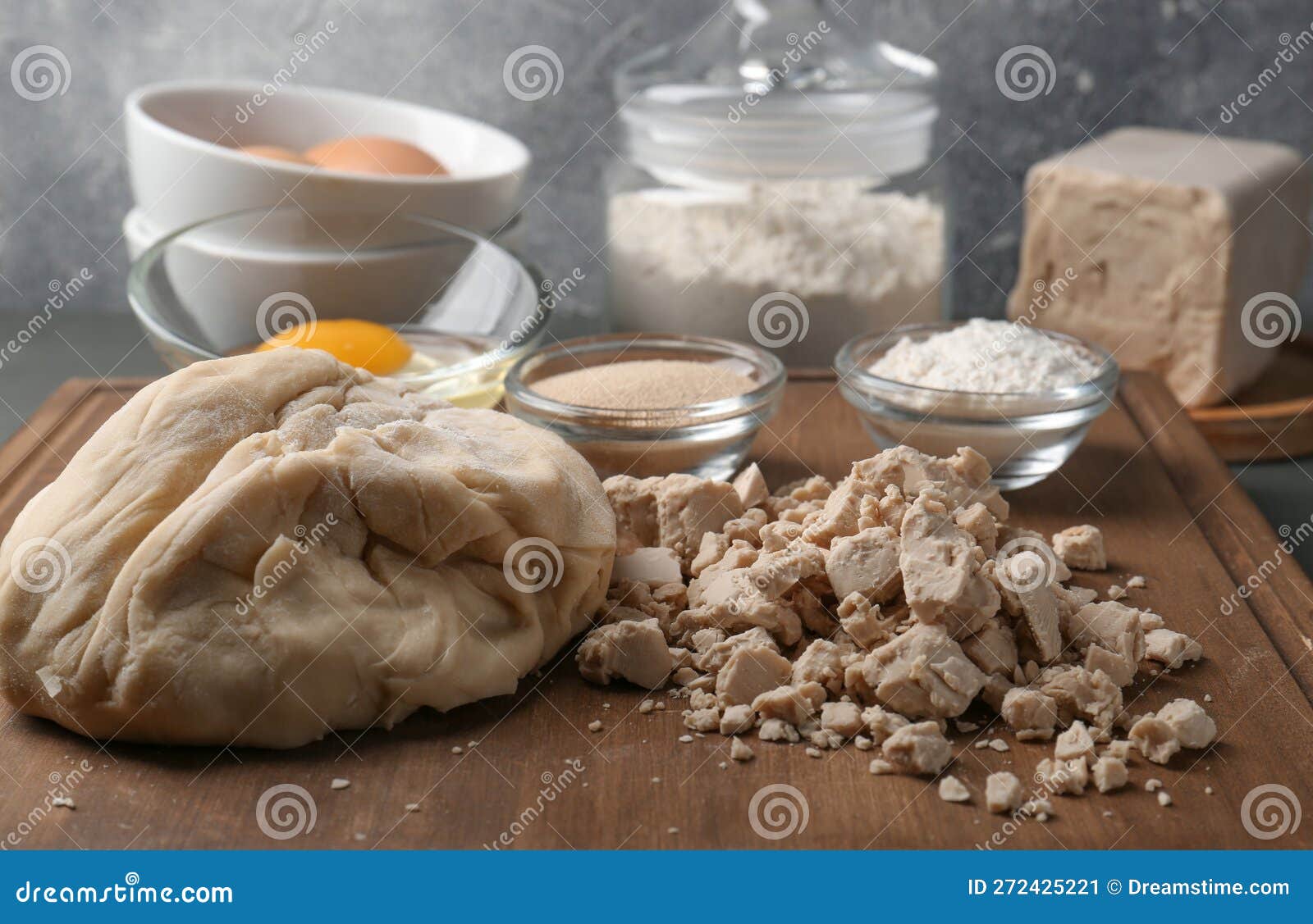 Different Types of Yeast, Eggs, Flour and Dough on Grey Table Stock ...