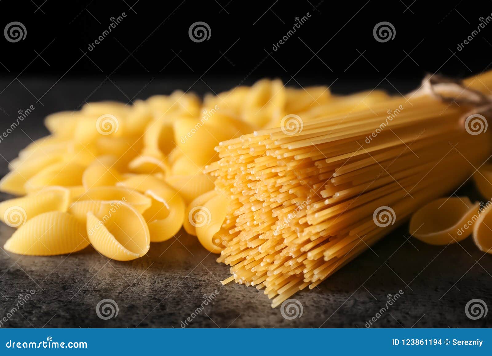 Different Uncooked Pasta on Table Stock Photo - Image of spaghetti ...