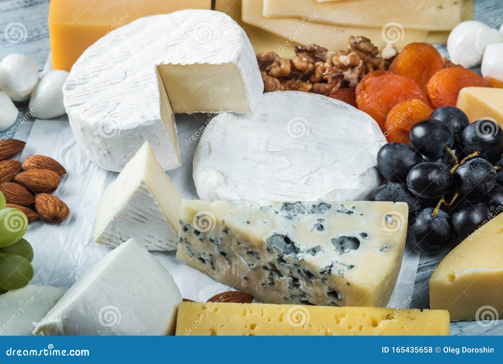 Different Varieties and Types of Cheese with Fruit, Nuts Stock Photo ...