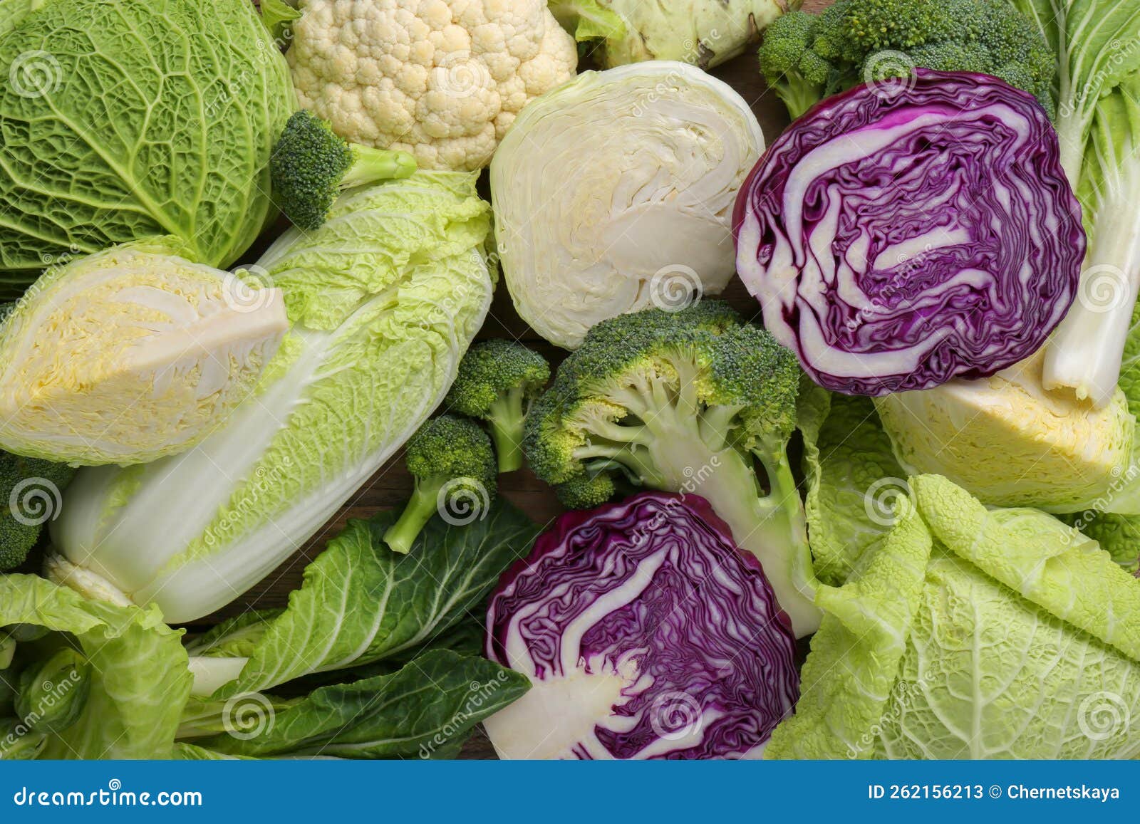 Different Whole and Sliced Types of Cabbage As Background, Top View ...