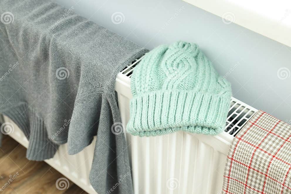 Different Winter Clothes Drying on Radiator Indoor Stock Image - Image ...
