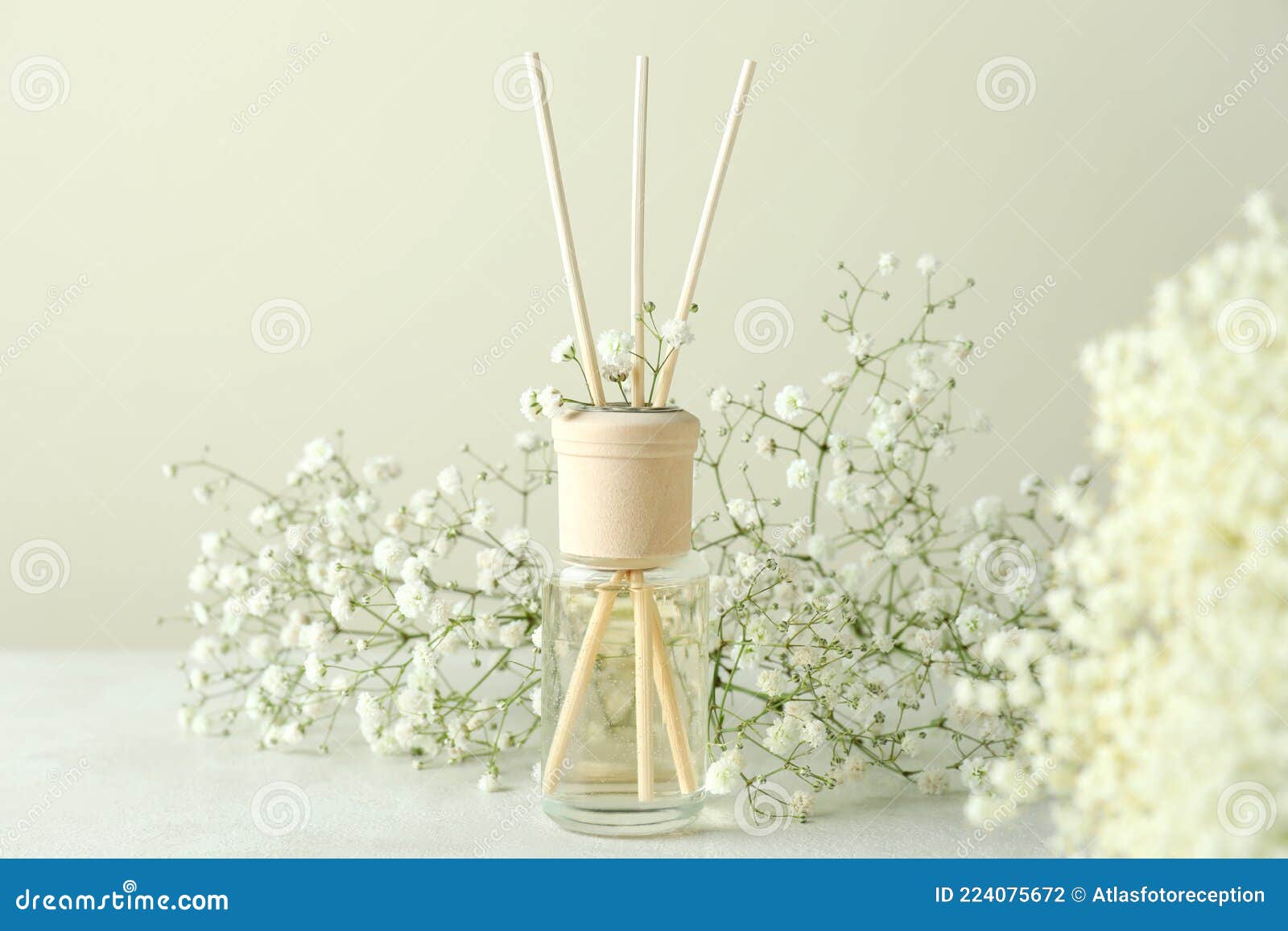 Diffuser and Flowers on White Textured Table Stock Photo - Image of ...