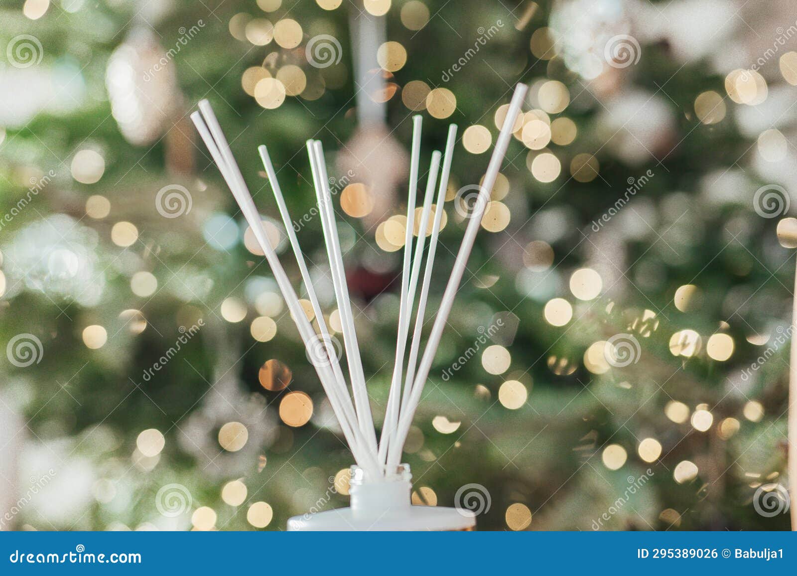 Diffuser with Sticks with Aroma on Christmas Shining Tree Background ...
