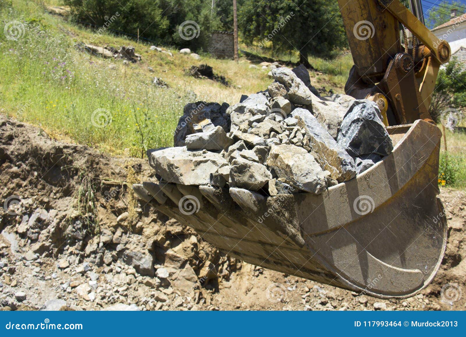 Digger Bucket Full of Rocks Stock Photo - Image of excavate, heavy ...