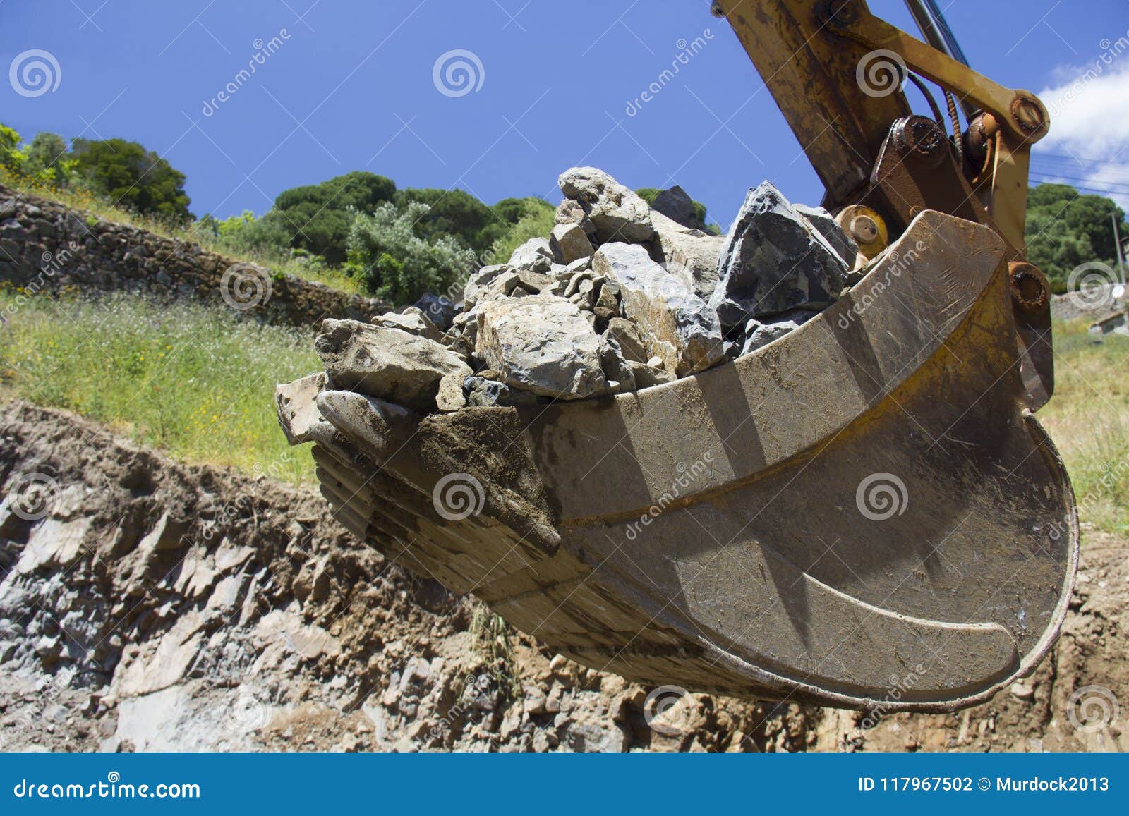 Digger Bucket Full of Rocks Stock Photo - Image of activity, bucket ...
