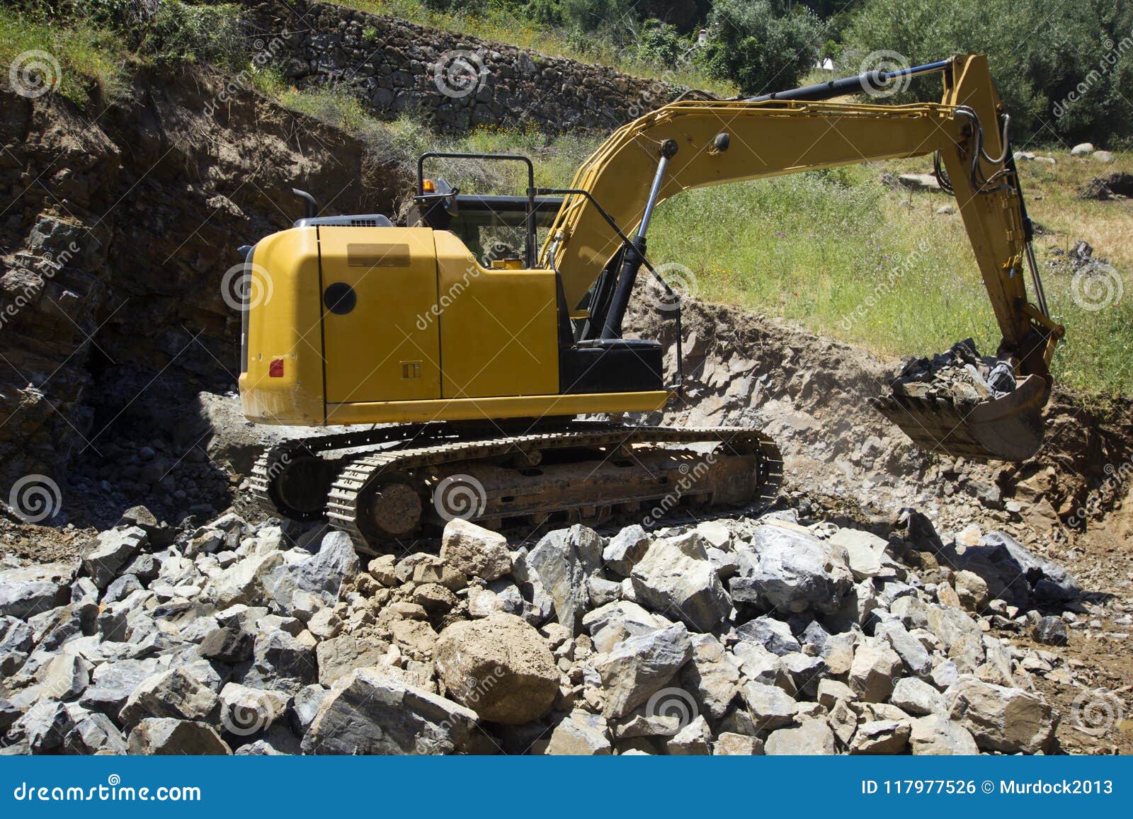 Digger Bucket Full of Rocks Stock Photo - Image of dirt, build: 117977526