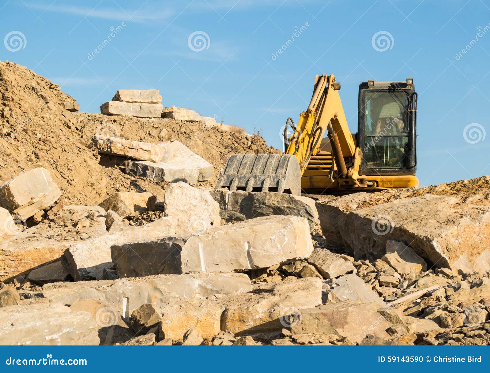 Digger on a Construction Site Building a Stone Wall Stock Photo - Image ...